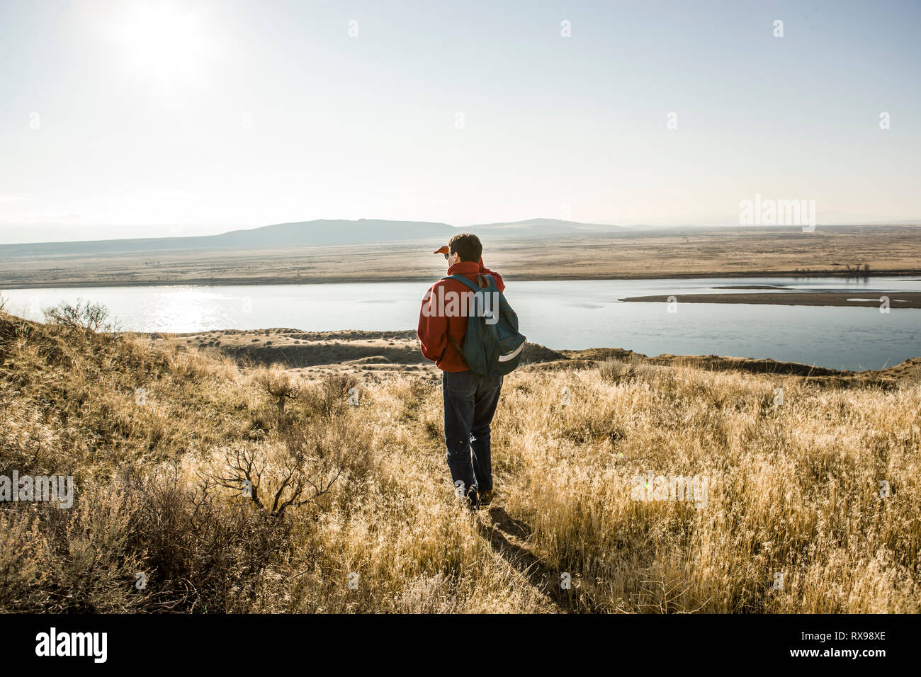 A man hikes towards the only free flowing portion of the Columbia River ...