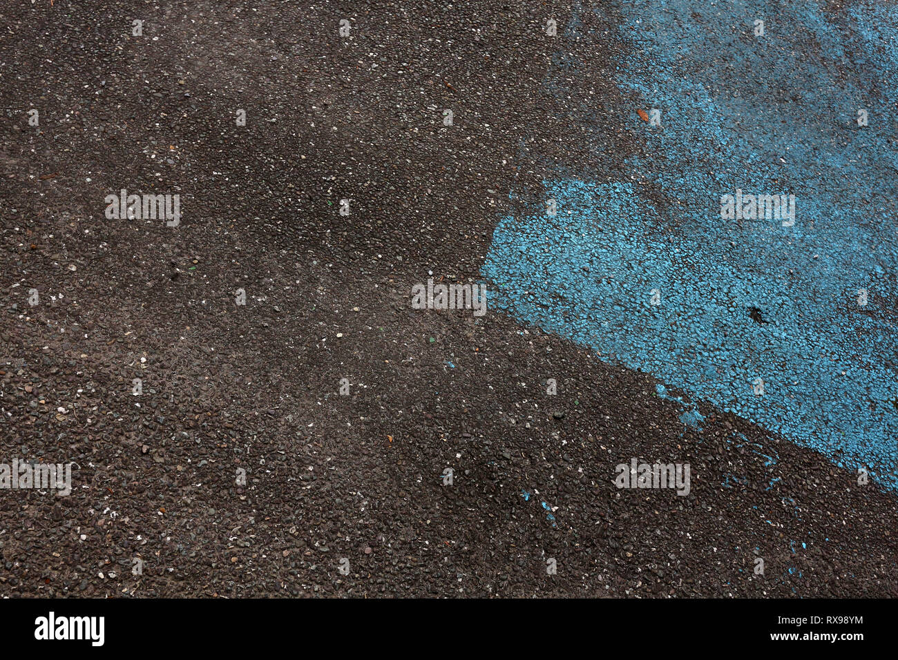 Blue paint on tarmac Stock Photo - Alamy