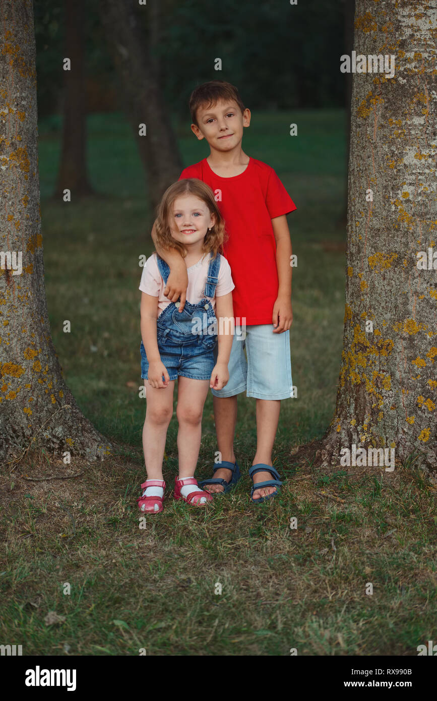 Happy brother sister hug in hi-res stock photography and images - Alamy