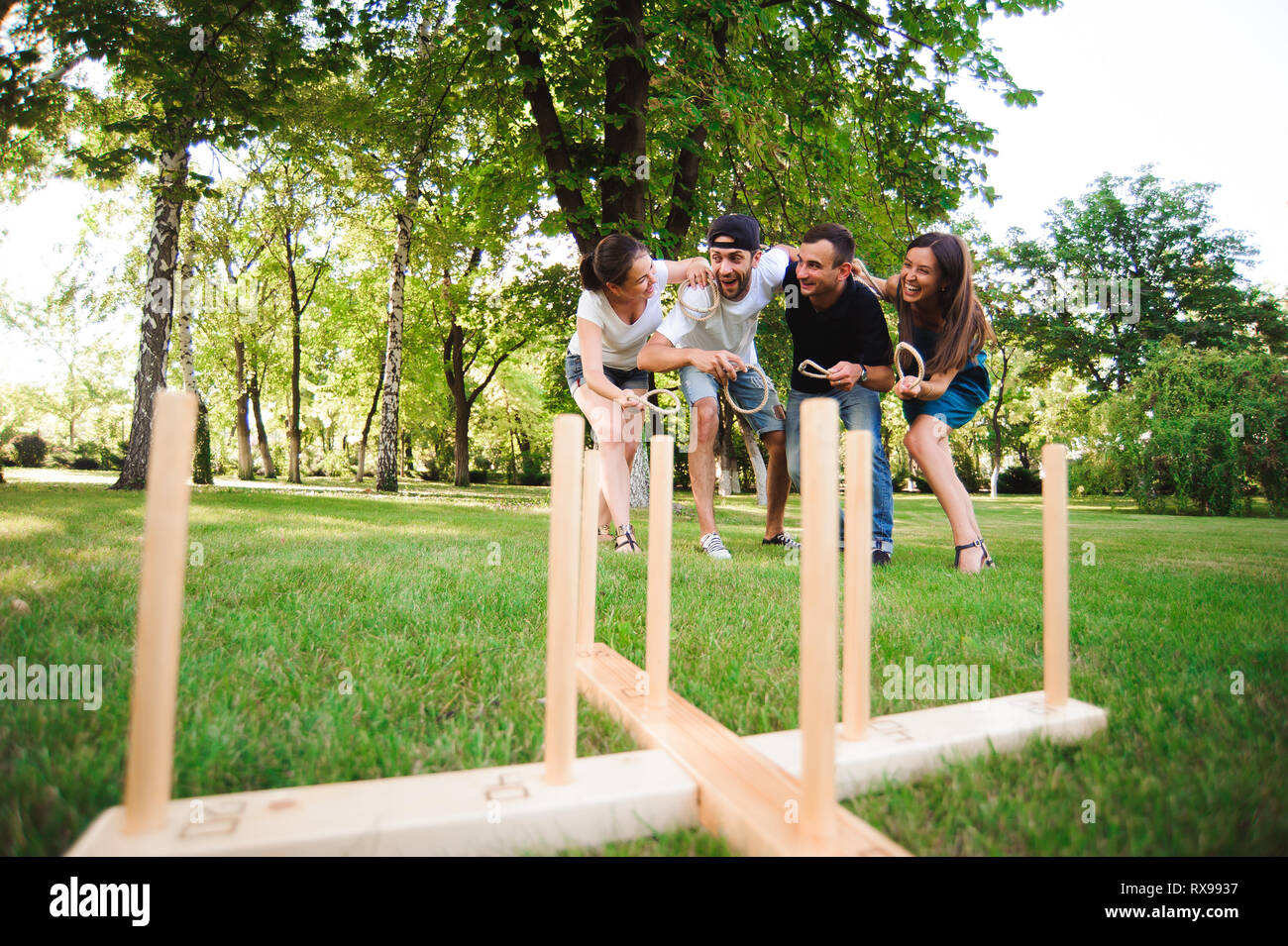 Outdoor games - ring toss, friends playing ring toss in a park Stock ...