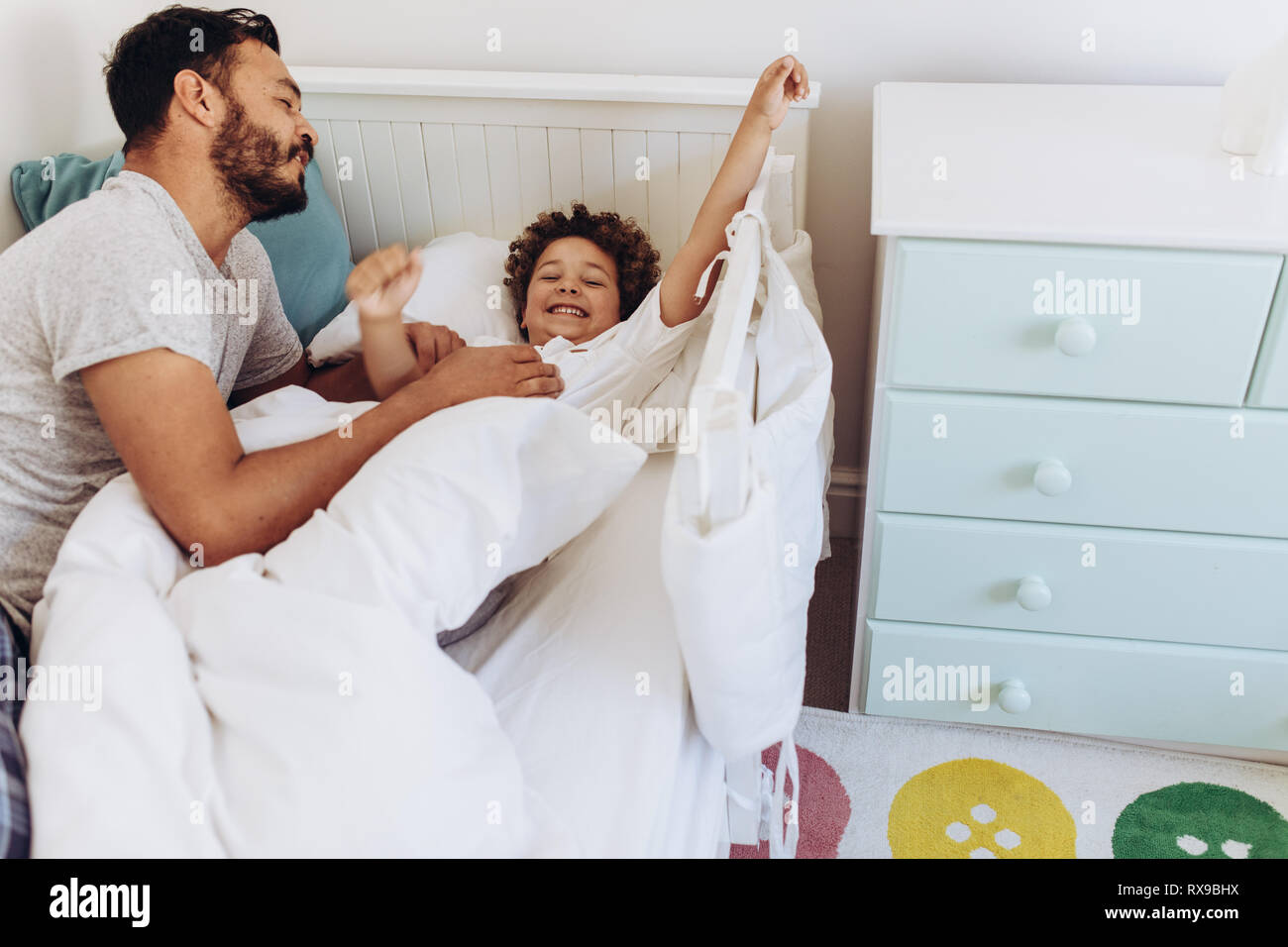 Child waking up bed hi-res stock photography and images - Alamy