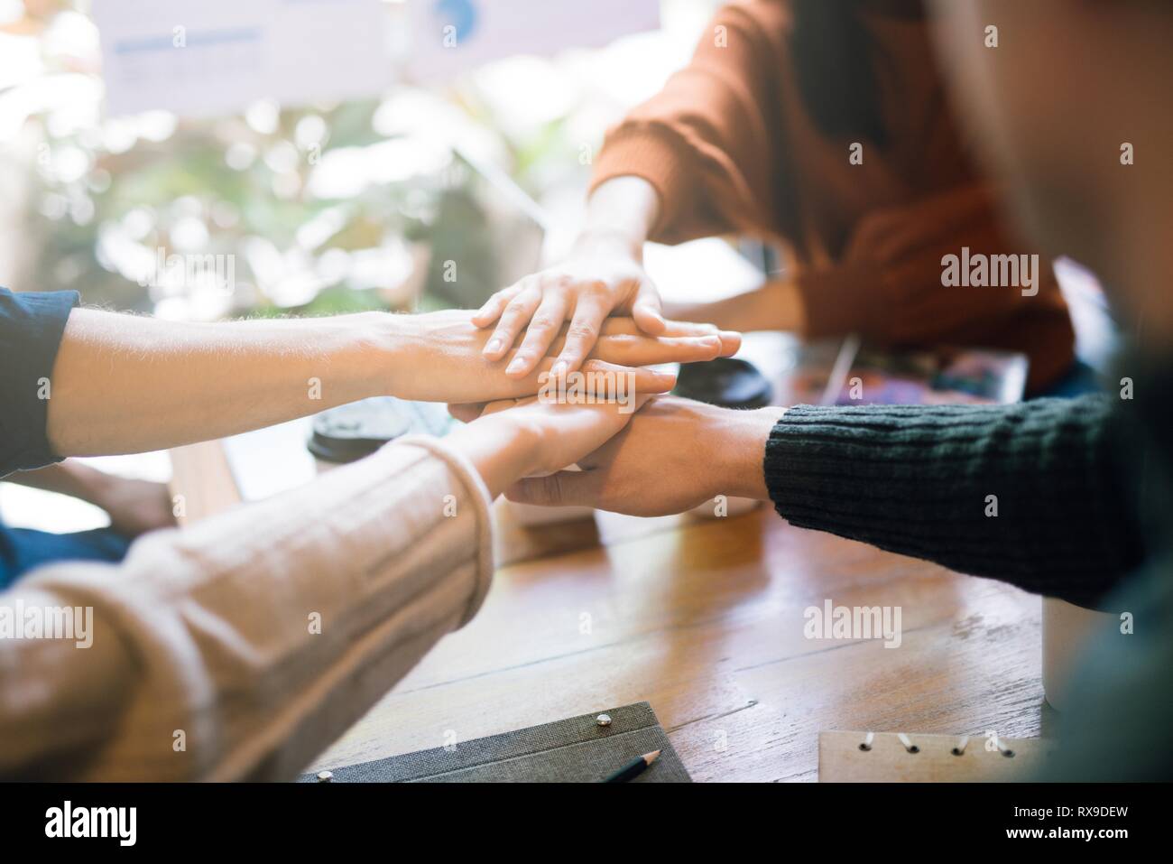 Hand of team stack hands support teamwork Stock Photo - Alamy