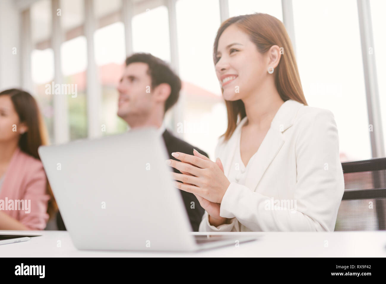 Happy business people clapping their hands, congratulation and ...