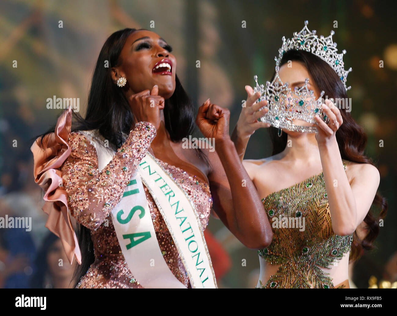 A beauty contestant from USA, Jazell Barbie Royale (L) is seen being ...