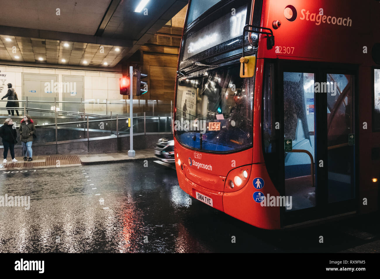 London, UK - January 26, 2019:Red bus waiting on red light by ...