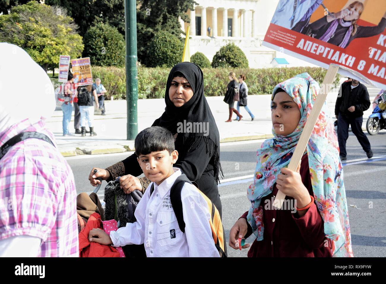 A family seen taking part in the march. Women's rights movements ...