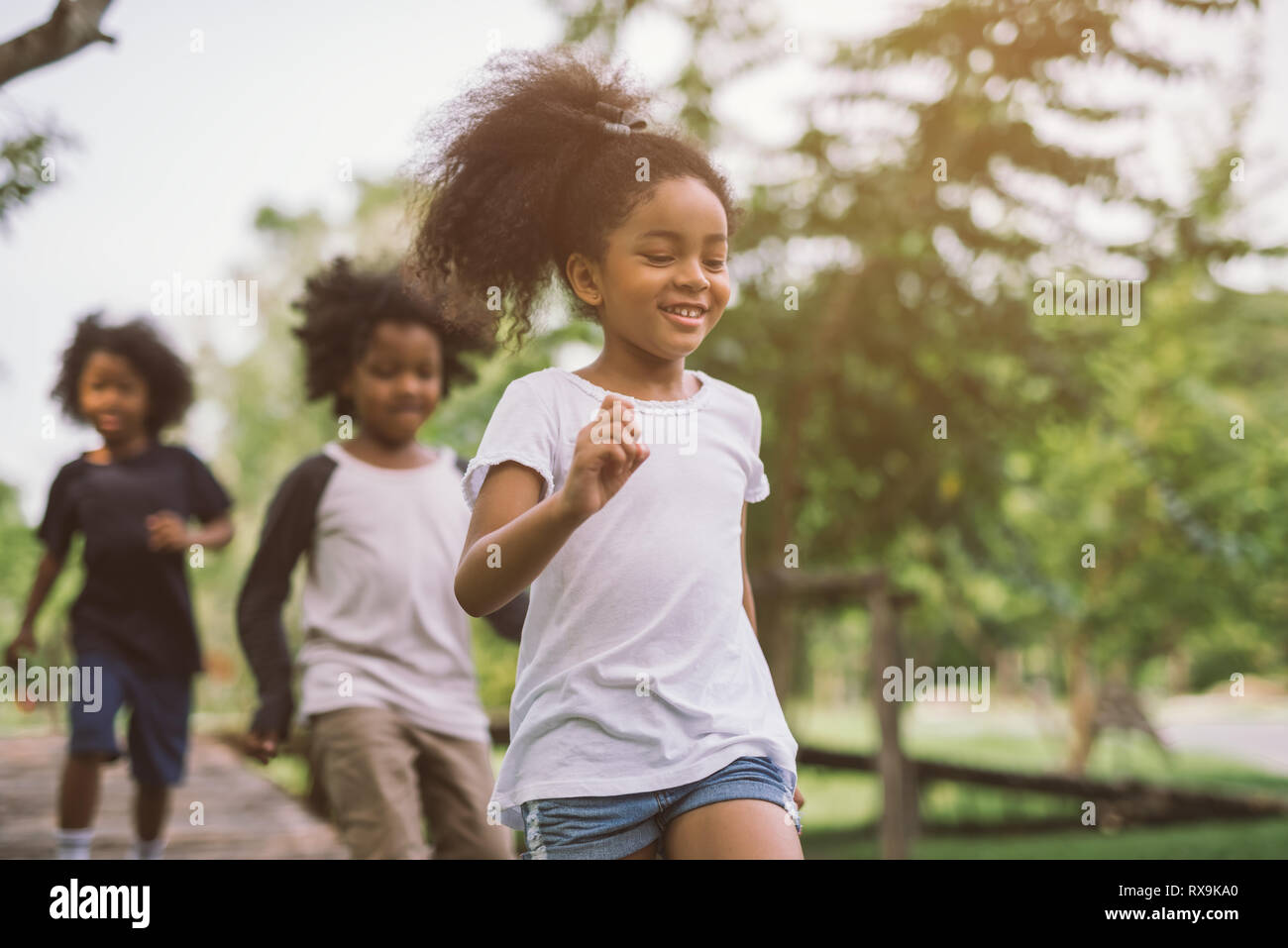 Kids ethnic outdoors sunny hi-res stock photography and images - Alamy