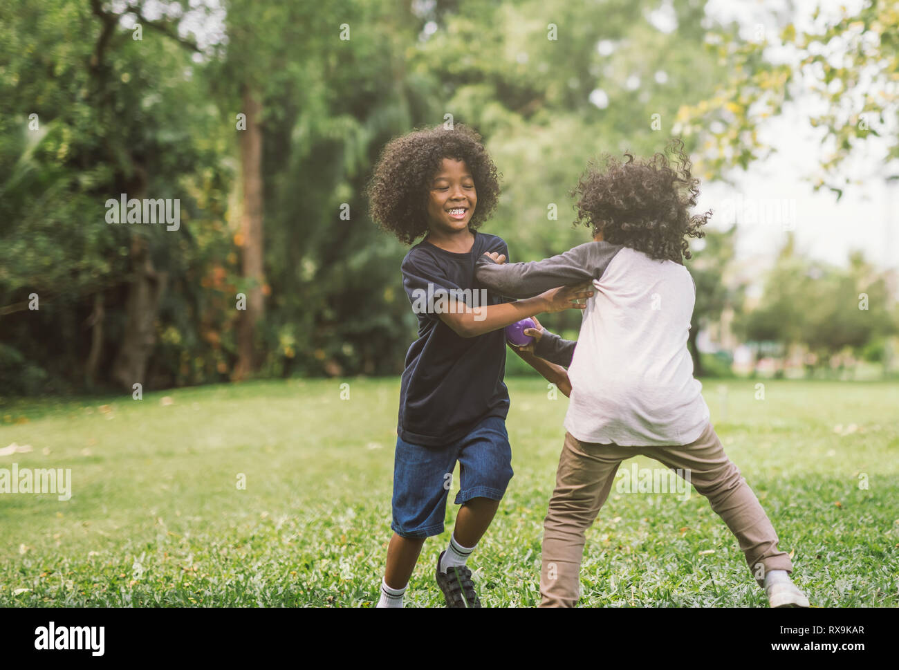 Kids playing with friends Stock Photo - Alamy