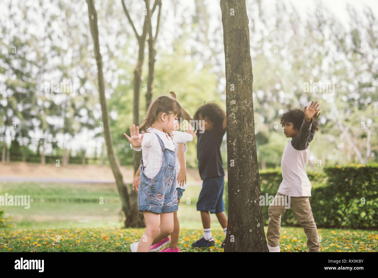Kids playing with friends Stock Photo - Alamy