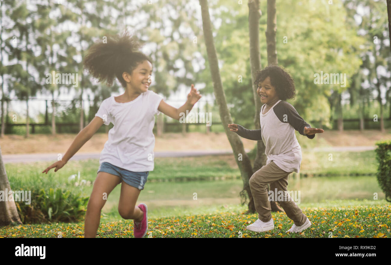 Kids playing with friends. Children Running At Park Stock Photo - Alamy