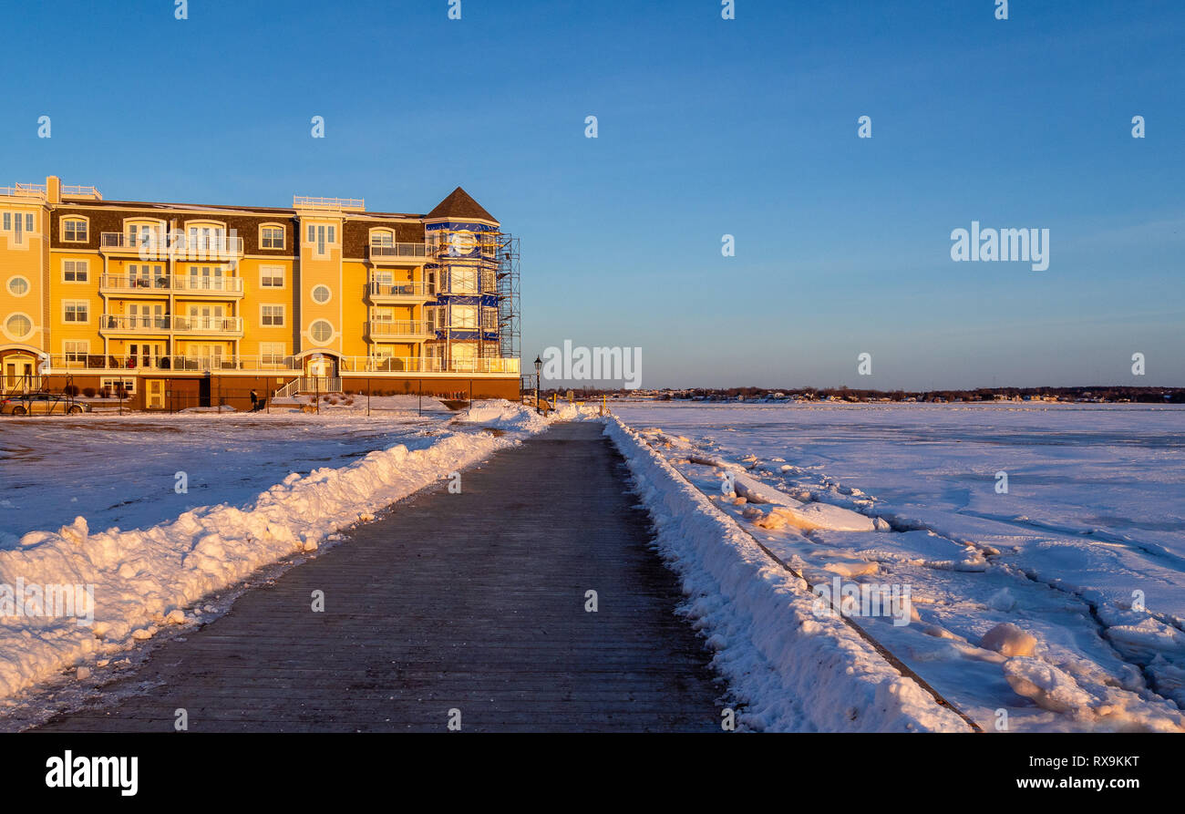 A waterfront building in the sunset Stock Photo - Alamy