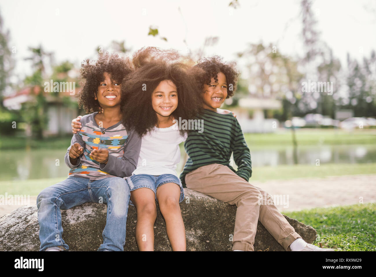African boys hug hi-res stock photography and images - Alamy