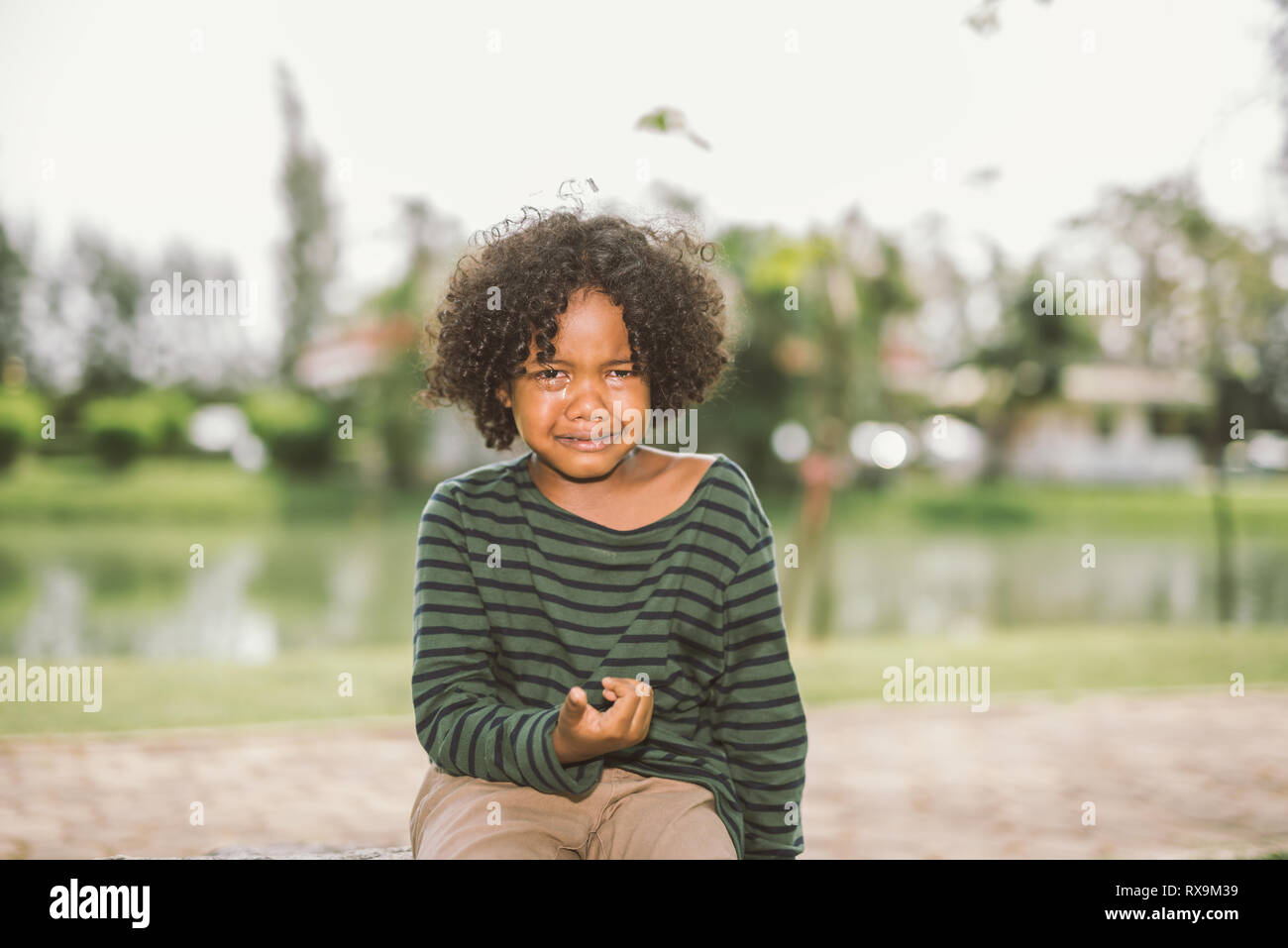 little African american boy crying Stock Photo - Alamy