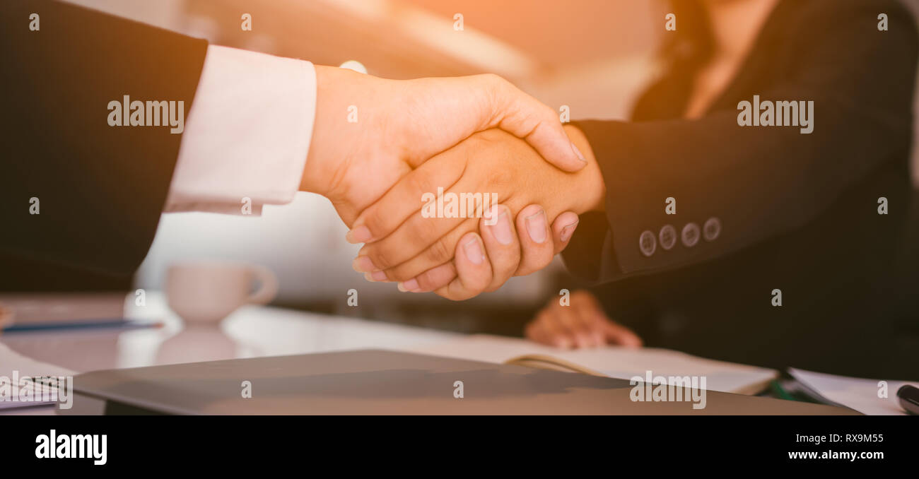 handshake business in office Stock Photo - Alamy