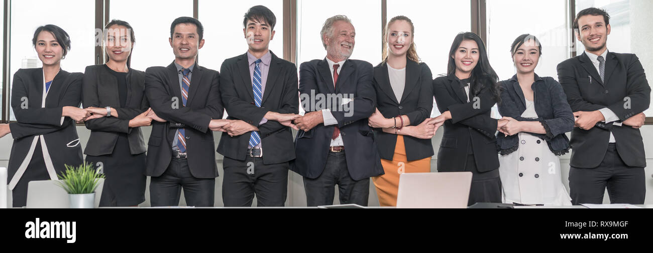 Asian business team Colleagues With Holding Hands together side by side ...