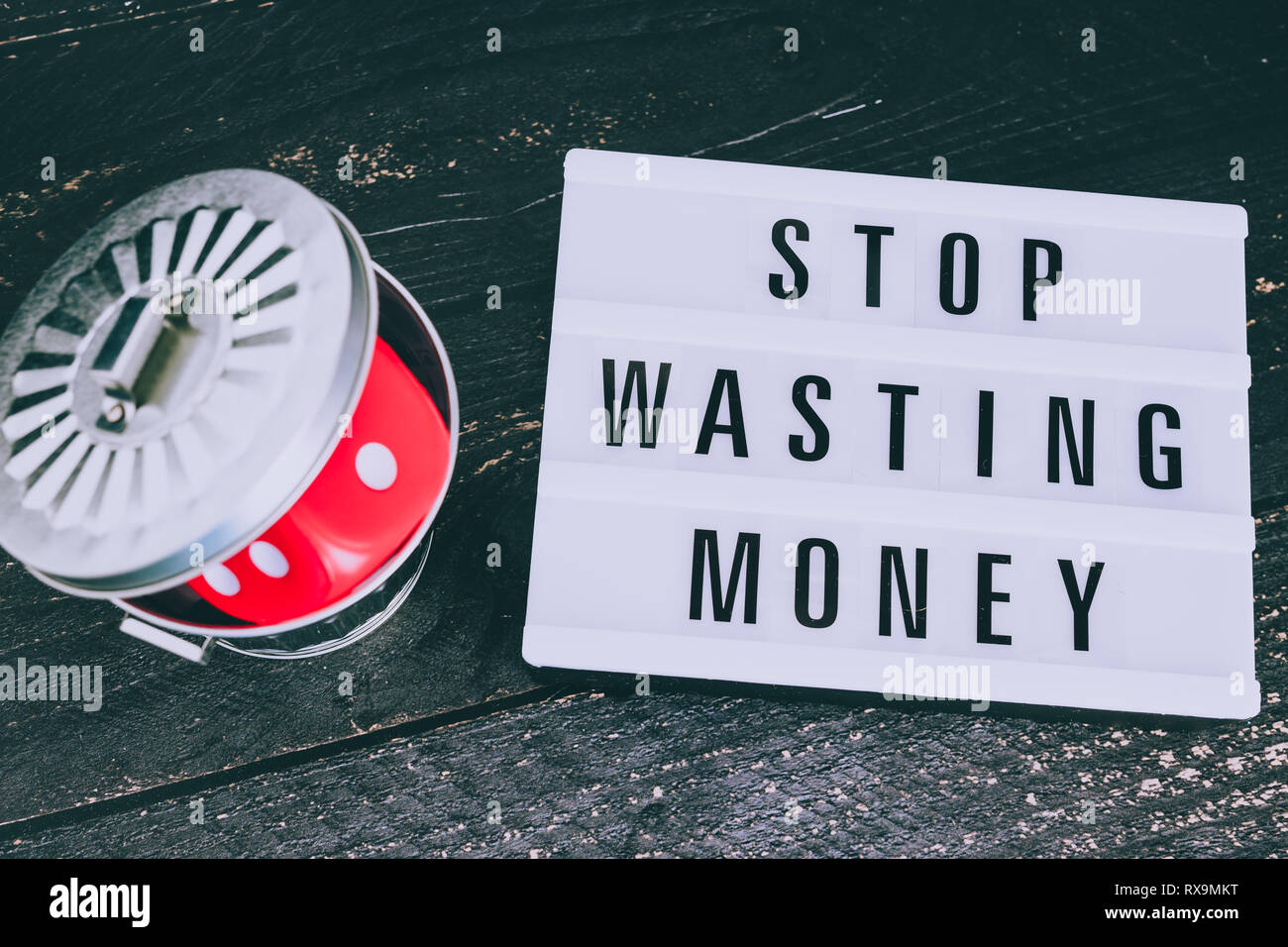 Stop wasting your money message on lightbox with gambilng dice thrown ...