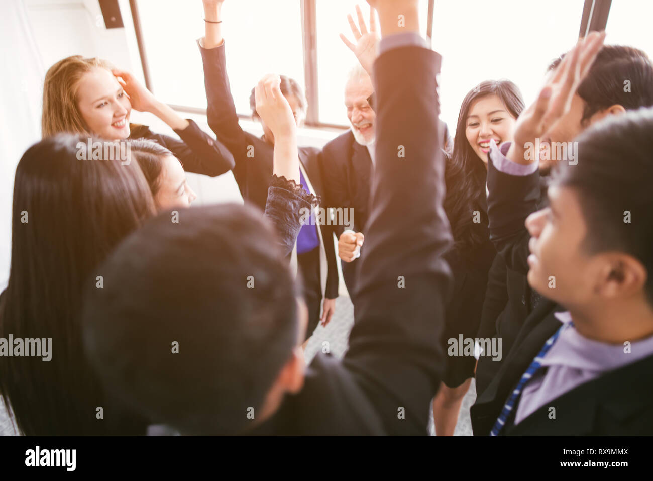 Business People Celebrating In Board Room. Group of business hands ...