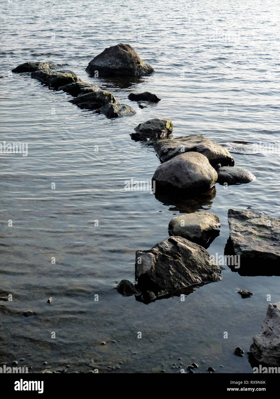 Stones in the Lake Stock Photo - Alamy