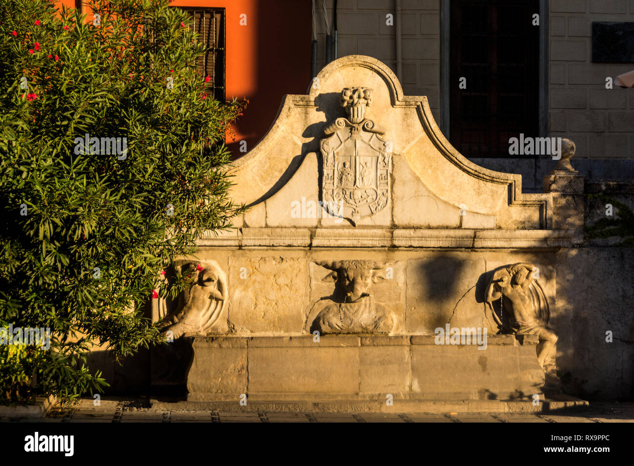 Exterior shot of buildings and spanish architecture; outdoor fountain ...