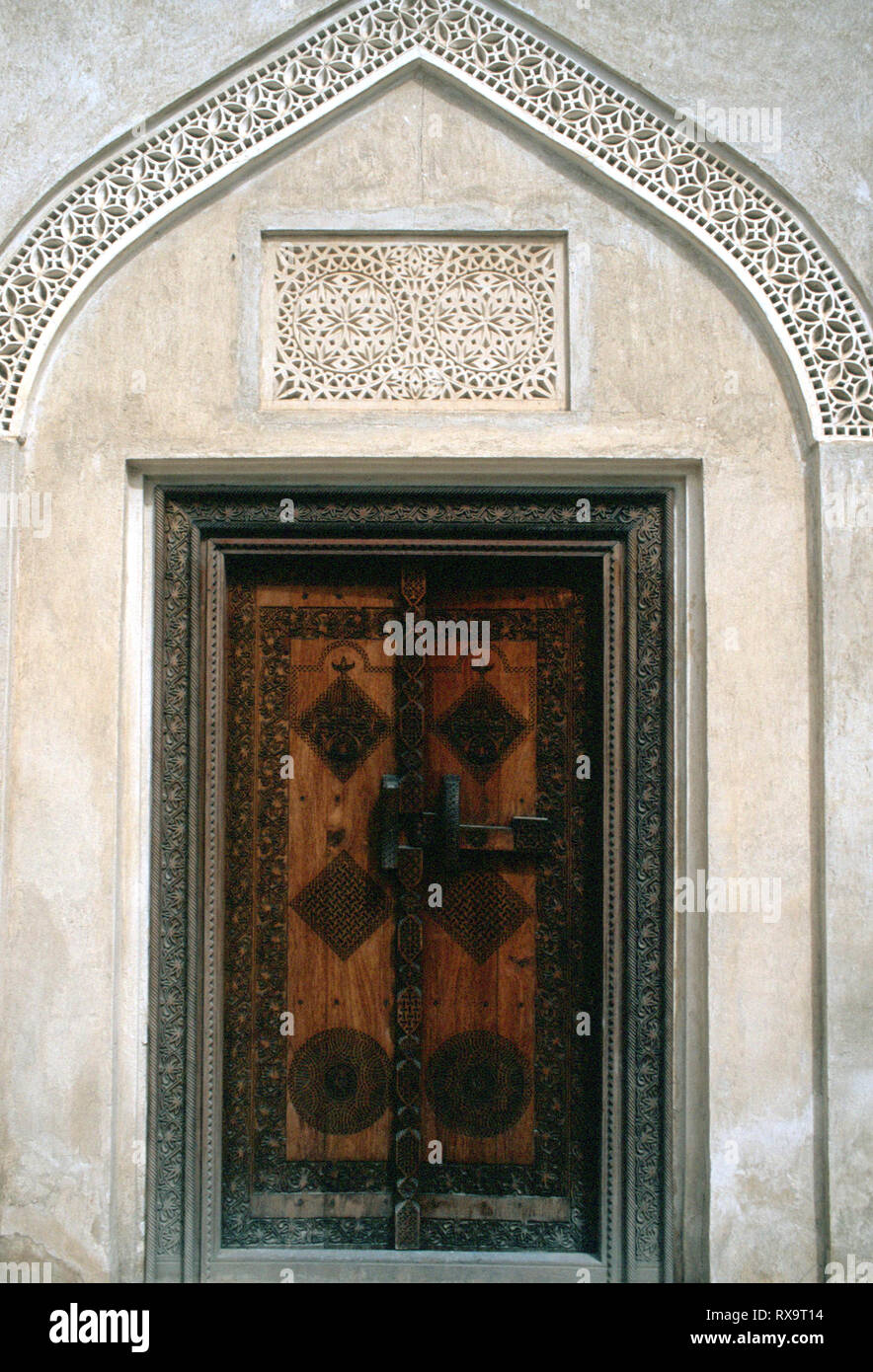 Traditional wooden door on a merchant's house in Bahrain, 1975 Stock ...