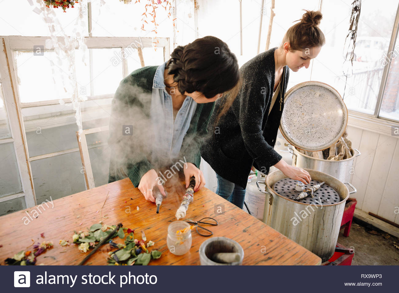 Women drying flowers for paper making Stock Photo - Alamy
