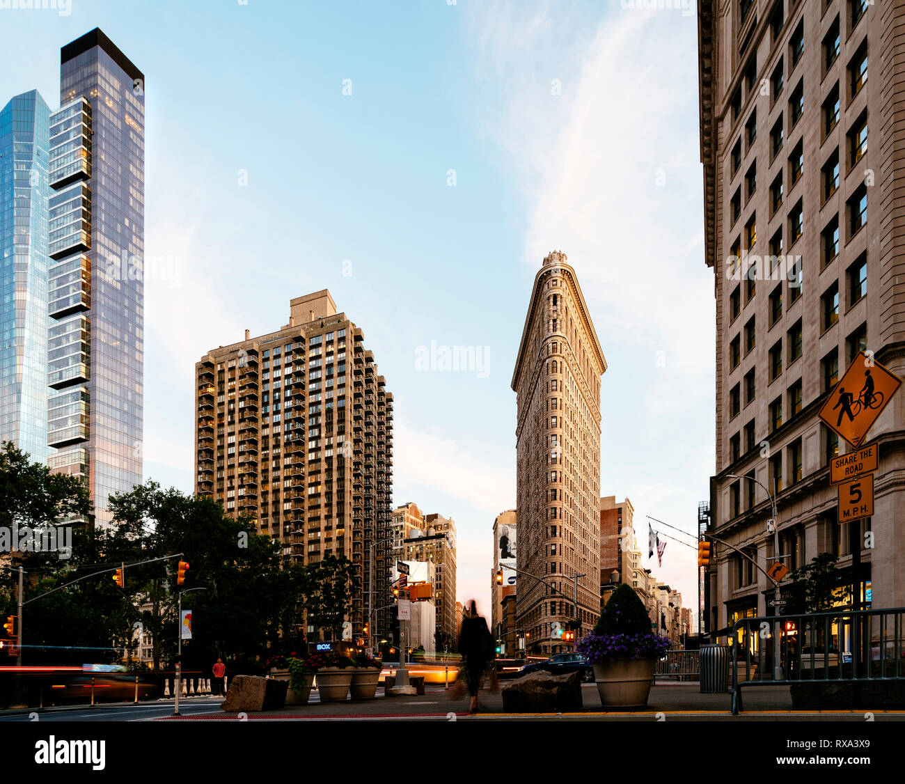 Low angle view of buildings against sky in city during sunset Stock ...