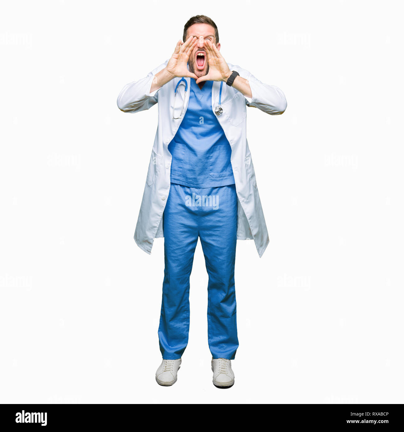 Handsome doctor man wearing medical uniform over isolated background ...