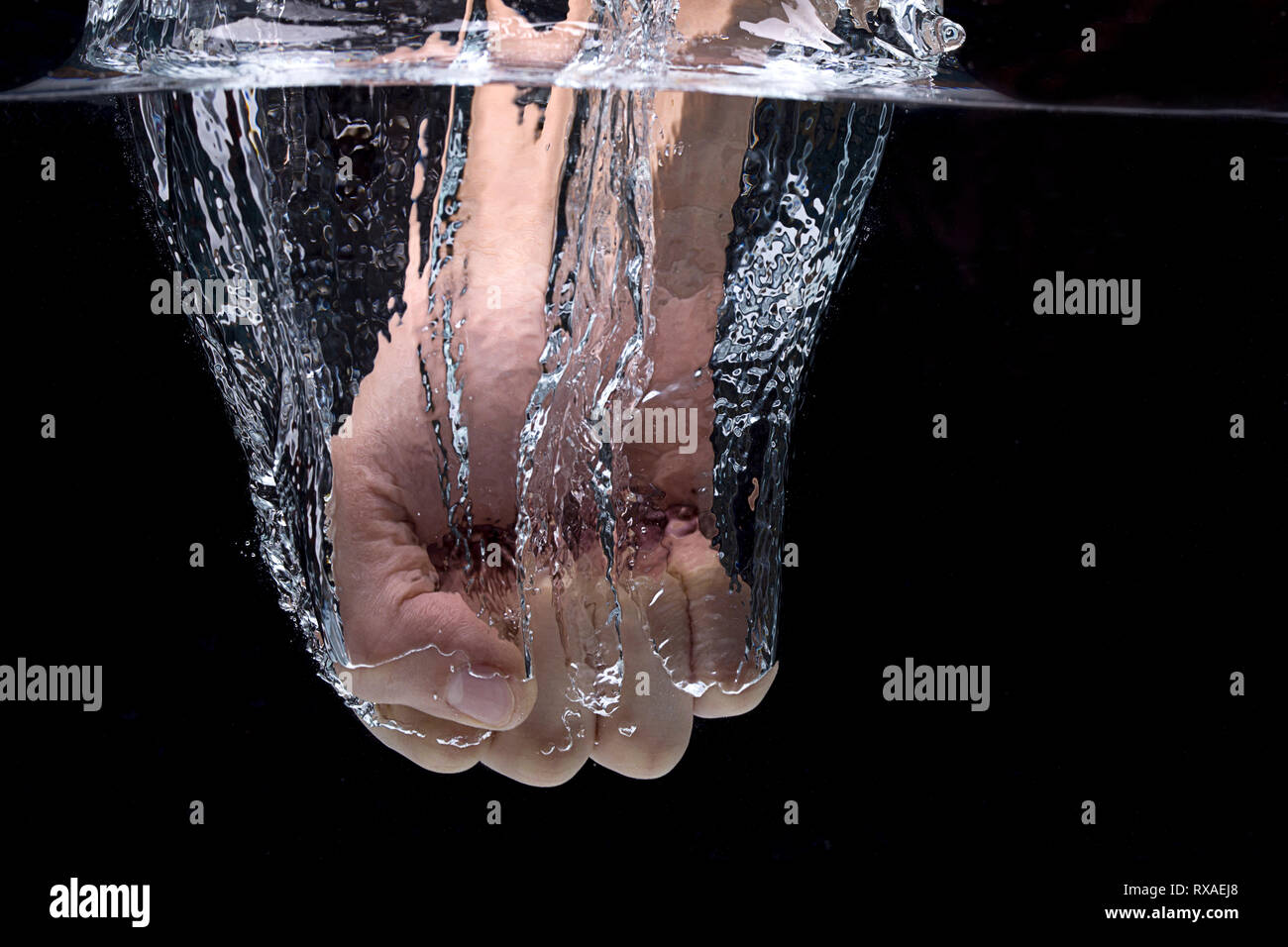 A concept photo of a fist punching into water in a studio setting Stock ...