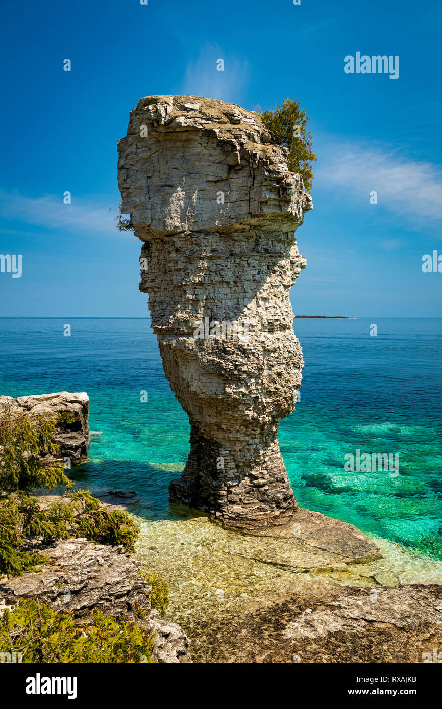 Large 'flowerpot' (sea stack) and the blue-green water of Georgian Bay ...