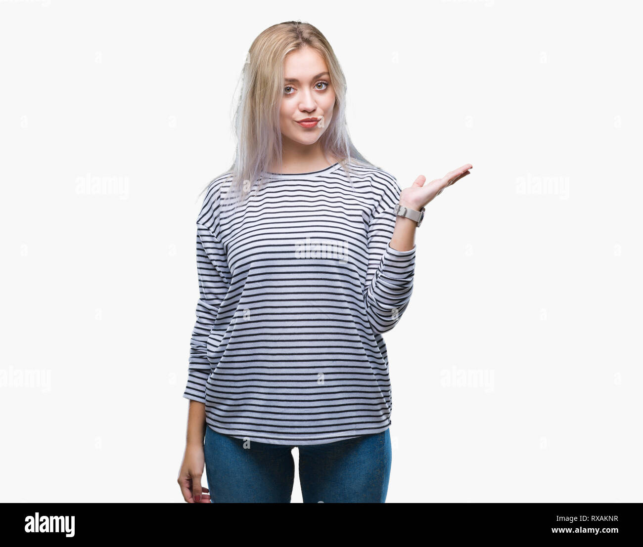 Young blonde woman over isolated background smiling cheerful presenting ...