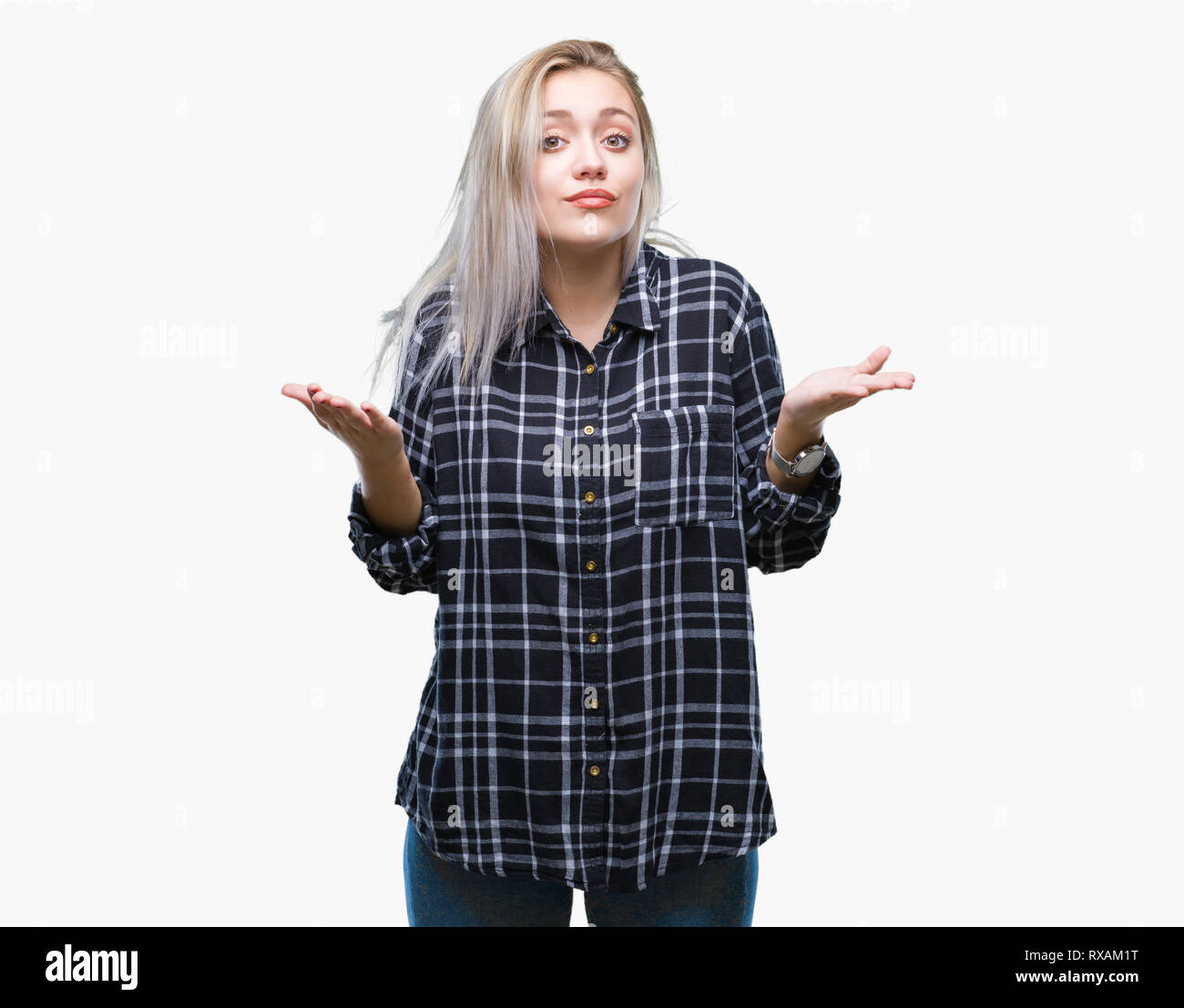 Young blonde woman over isolated background clueless and confused ...