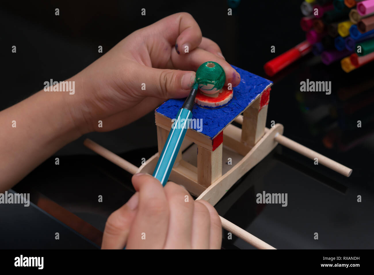 kid painting a dummy palanquin Stock Photo - Alamy