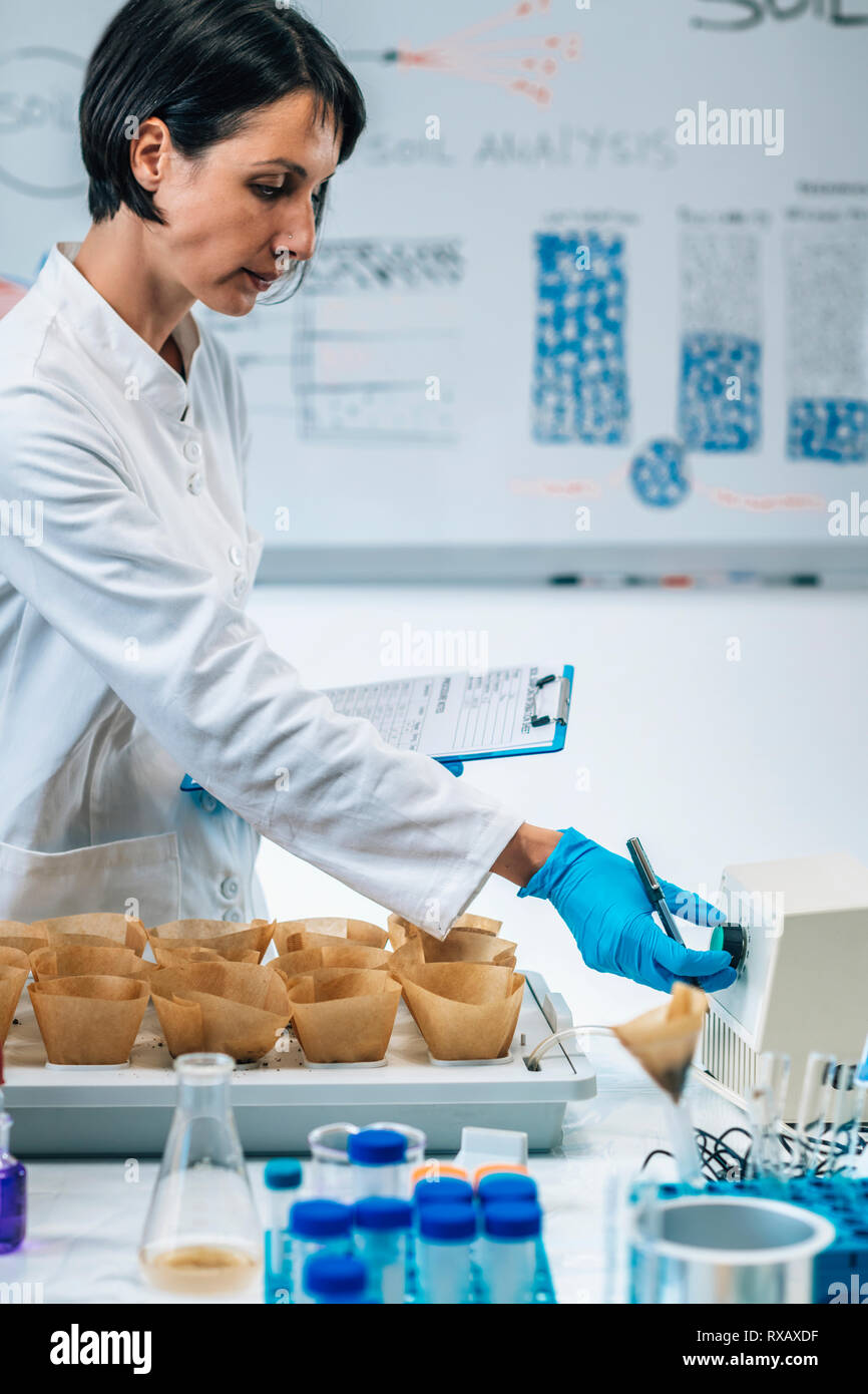 Soil scientist taking notes in laboratory Stock Photo - Alamy