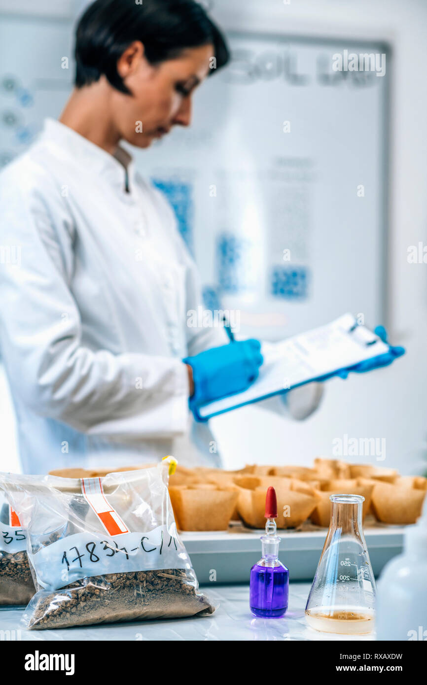 Soil scientist taking notes in laboratory Stock Photo - Alamy