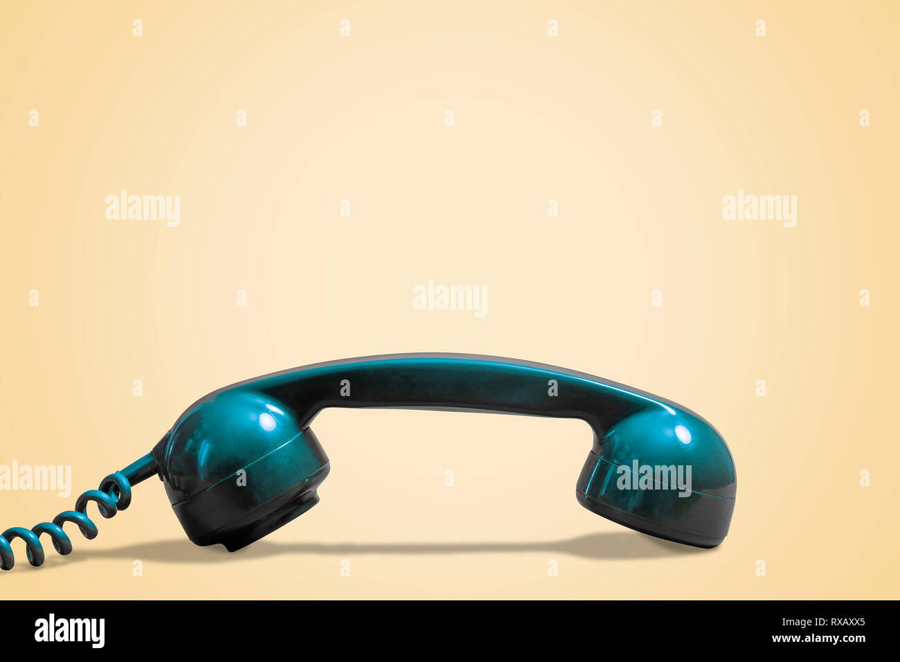 Blue vintage telephone on beige background Stock Photo - Alamy