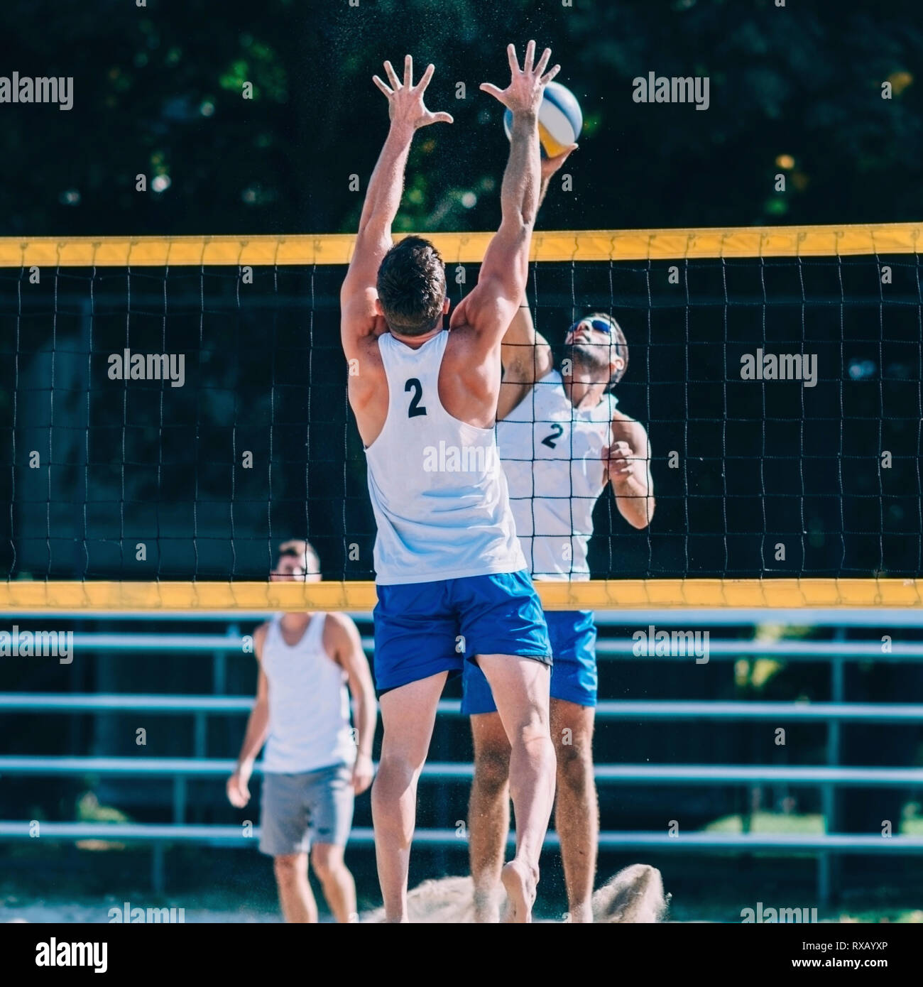 Beach volleyball team Stock Photo - Alamy