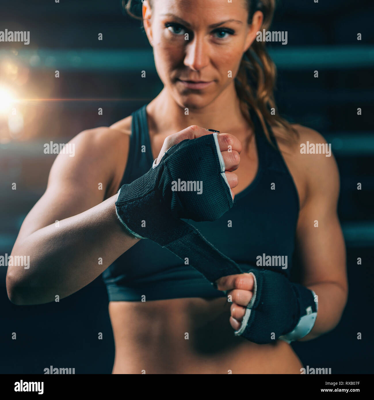 Female boxer wrapping hands Stock Photo - Alamy