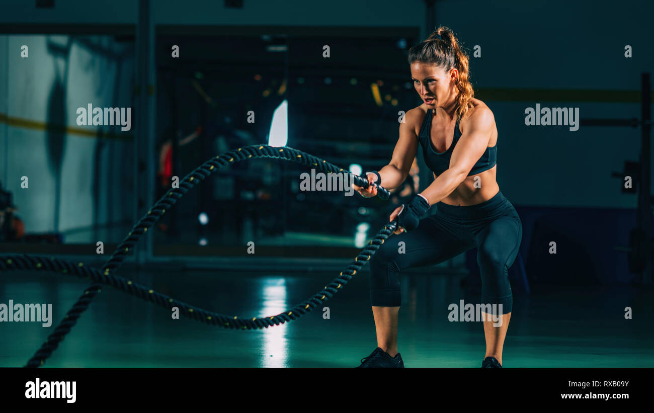 Gym swinging battle ropes hi-res stock photography and images - Alamy