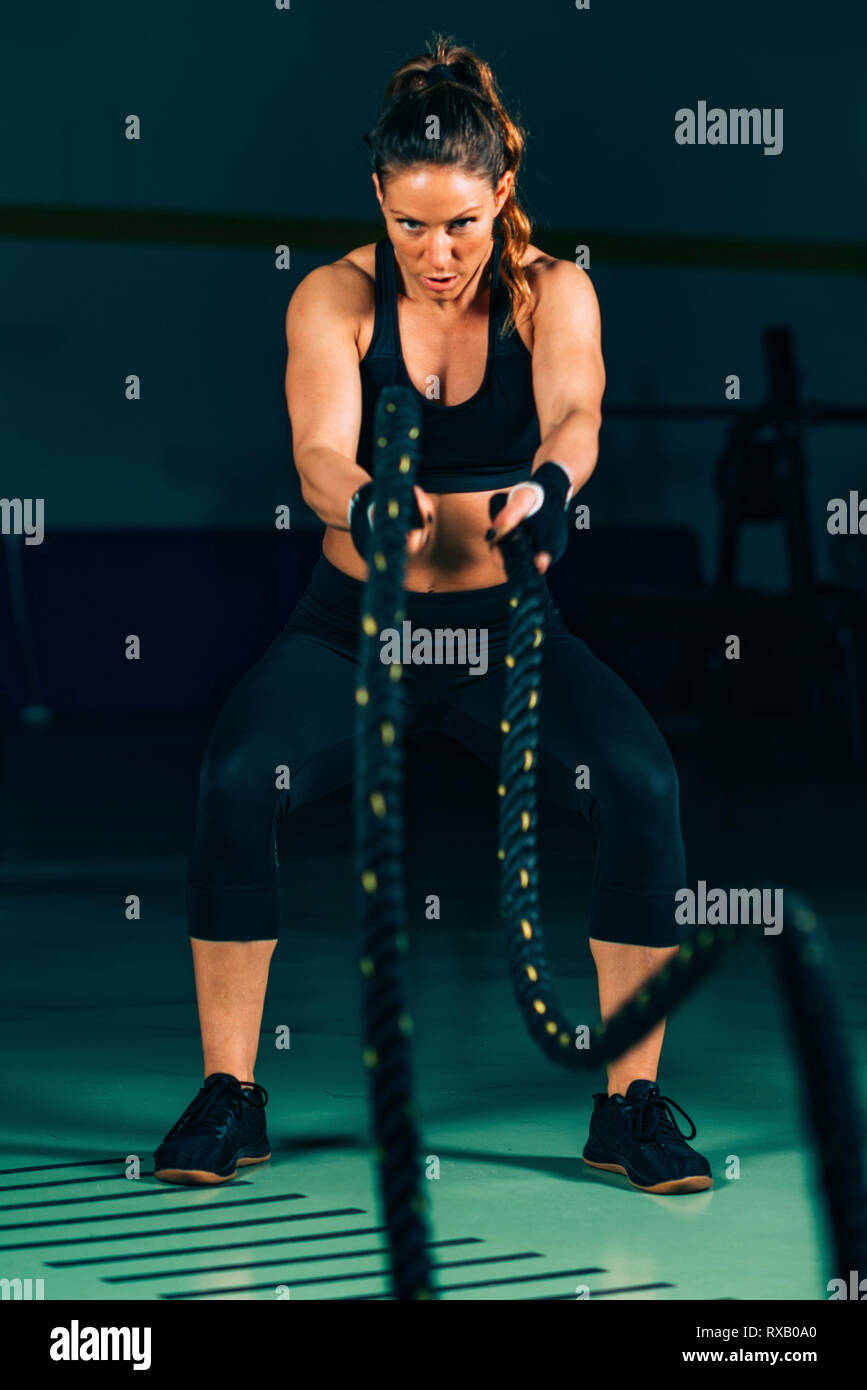 Gym swinging battle ropes hi-res stock photography and images - Alamy