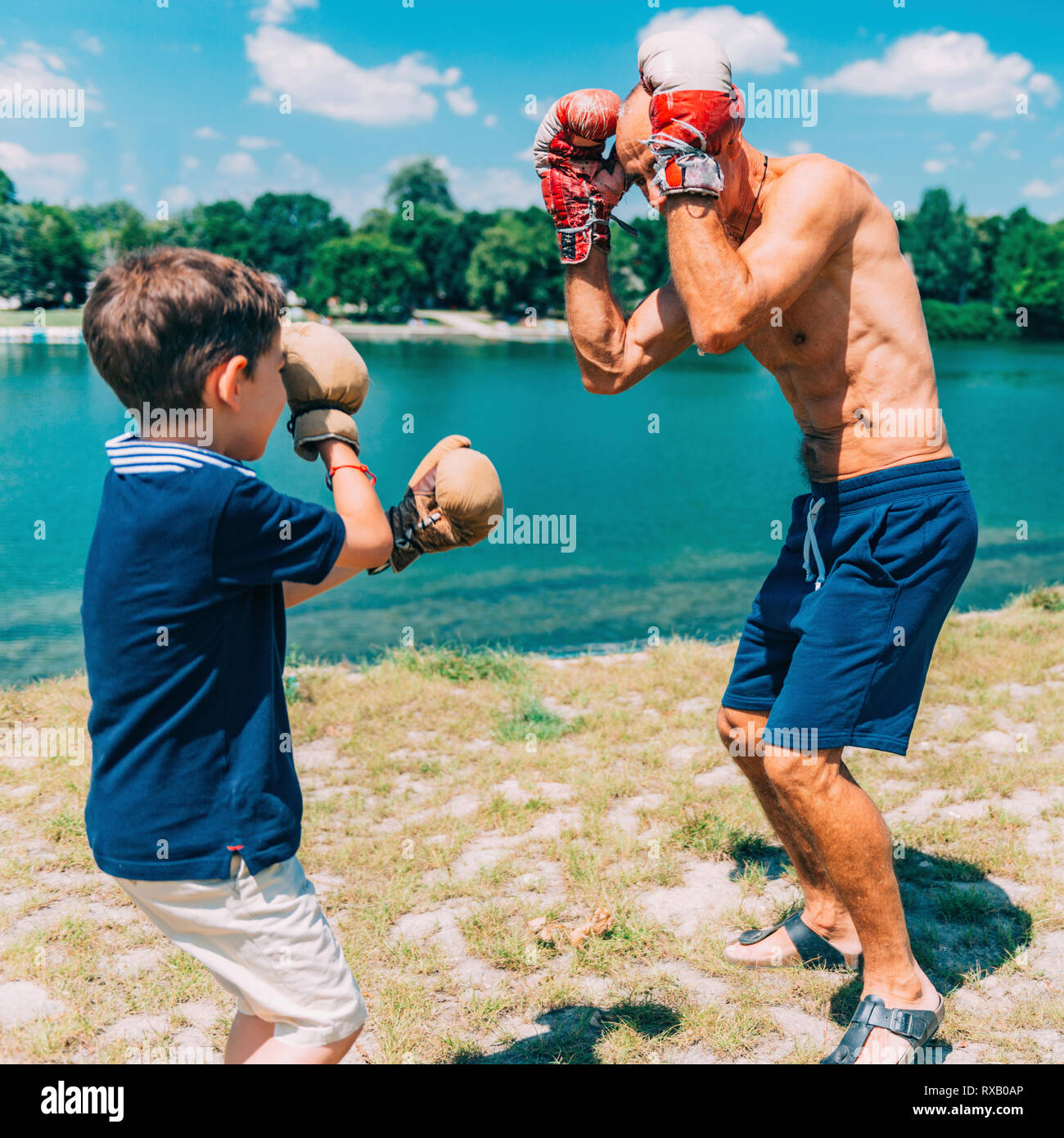 Grandfather and grandson boxing Stock Photo - Alamy