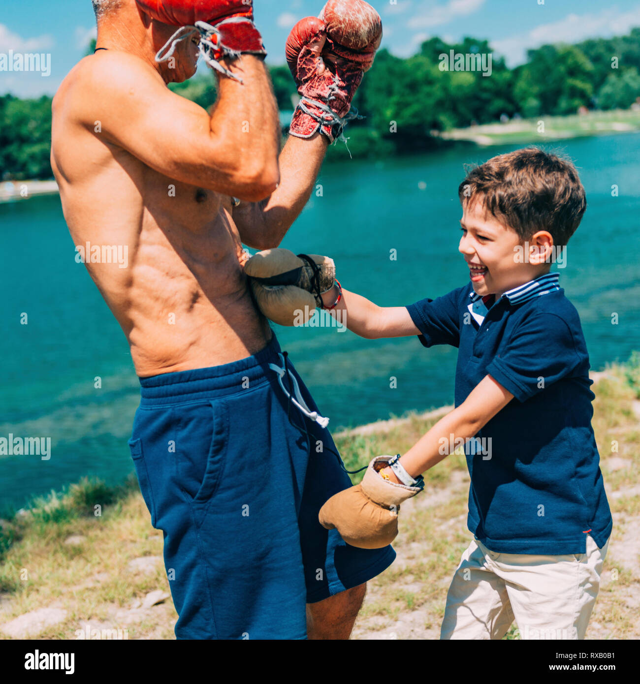 Grandfather and grandson boxing Stock Photo - Alamy
