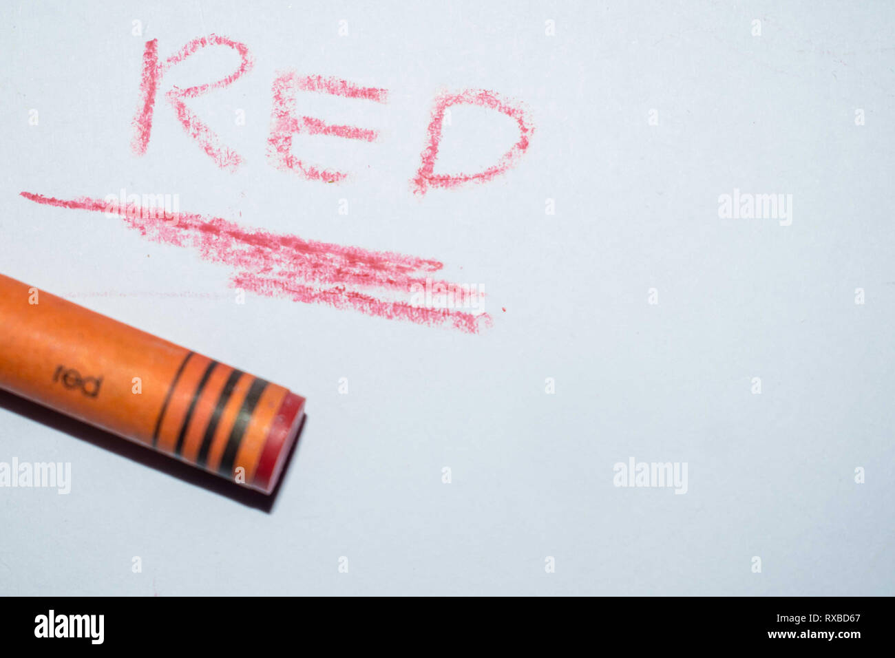 Hand writing of a RED text on a white background and red crayond Stock ...