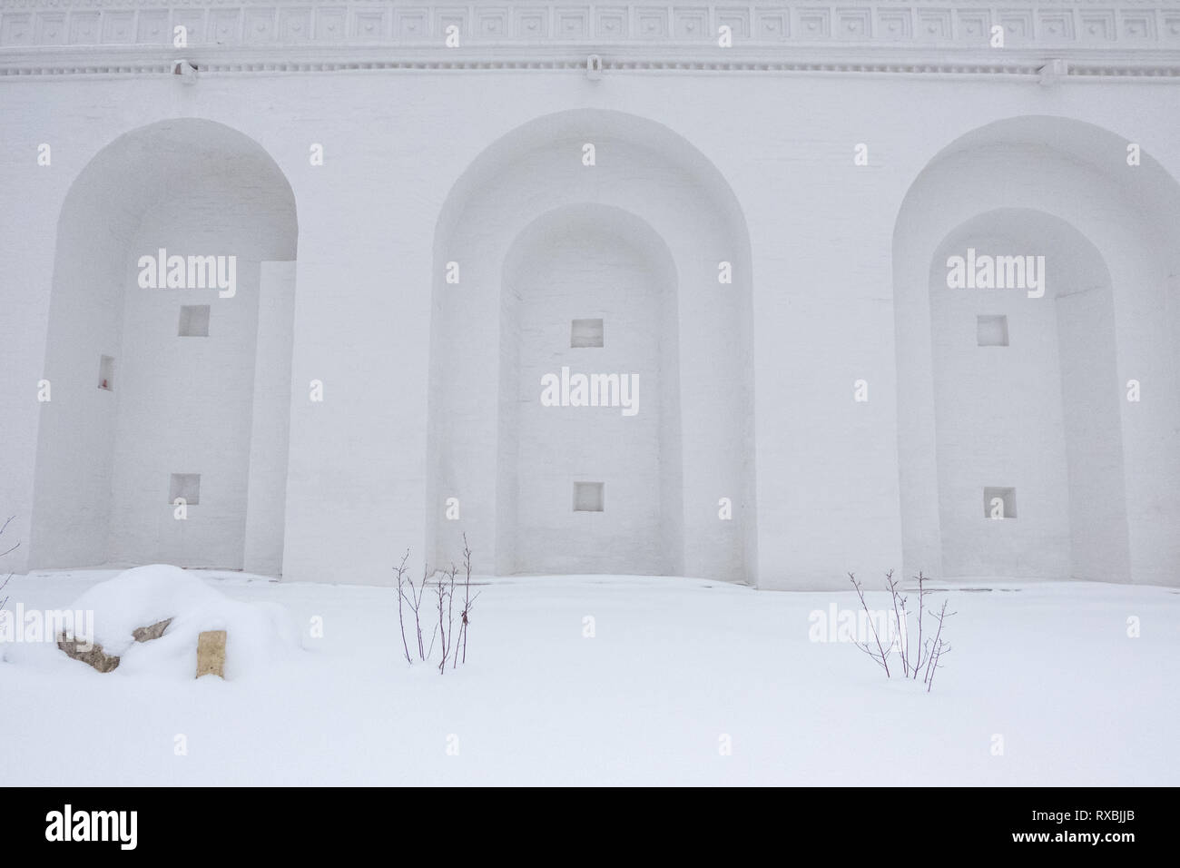 White exterior building with snow in the front Stock Photo - Alamy
