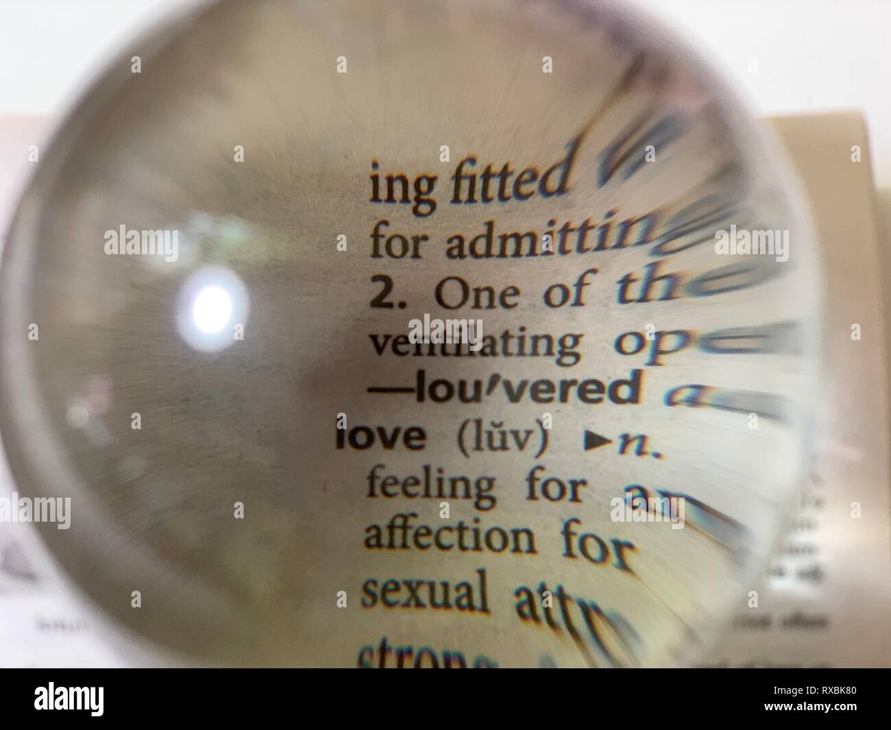 crystal ball on the dictionary Stock Photo - Alamy