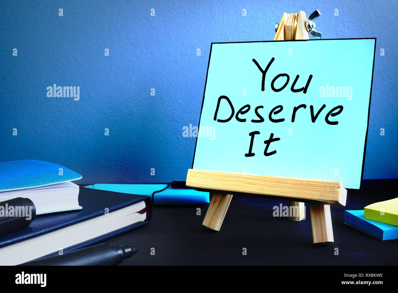 You deserve it written text on the table. Motivation and inspiration ...