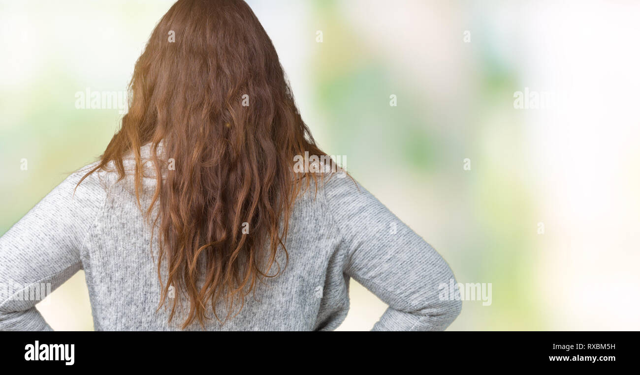 Beautiful plus size young woman wearing winter jacket over isolated ...