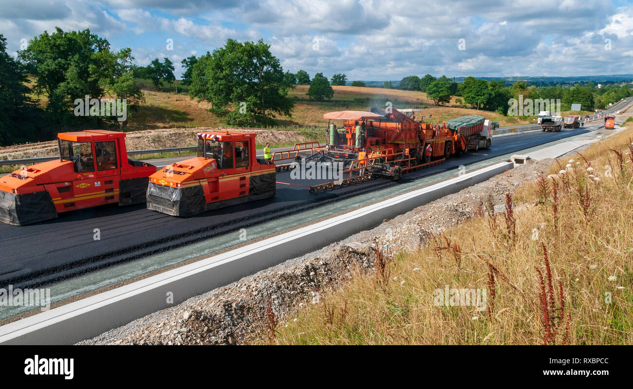 Asphalt application on an express road. All equipment in action asphalt ...