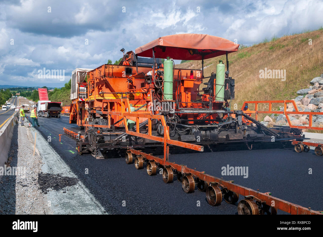 Rear view of a paver, paver screed and control system Stock Photo - Alamy