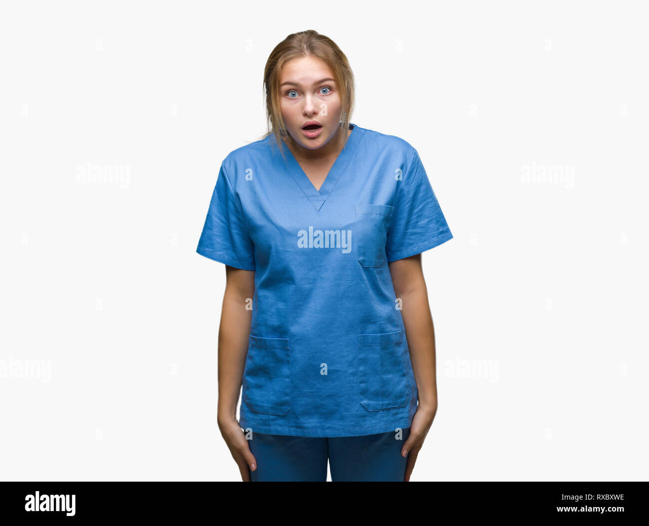 Young caucasian nurse woman wearing surgeon uniform over isolated ...