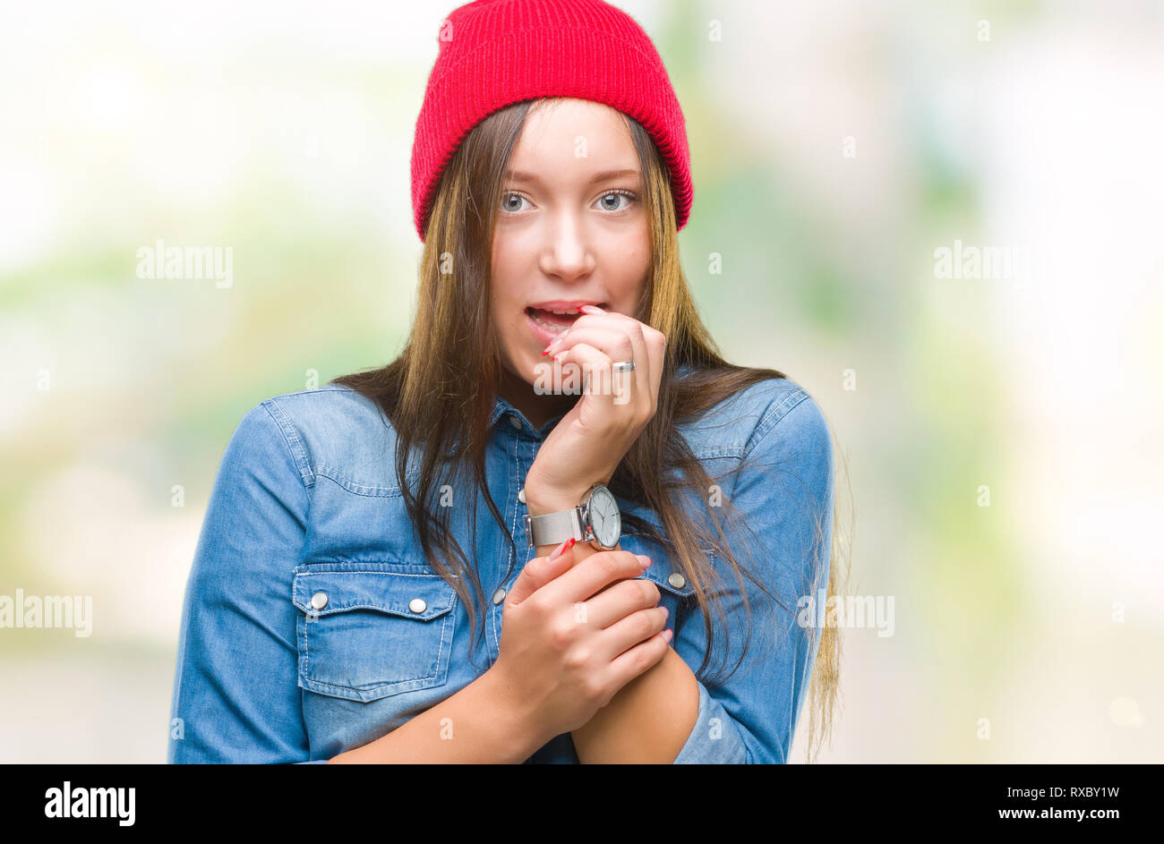 Young caucasian beautiful woman wearing wool cap over isolated ...